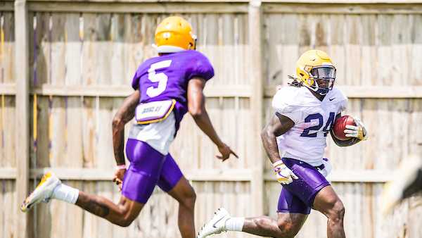 The LSU Tigers continue fall camp with another practice with shoulder pads.