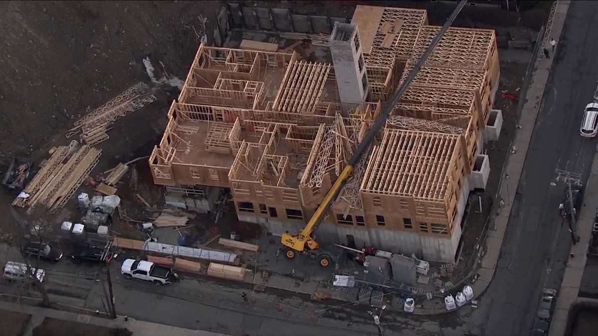 Crane falls onto building under construction in Brookline