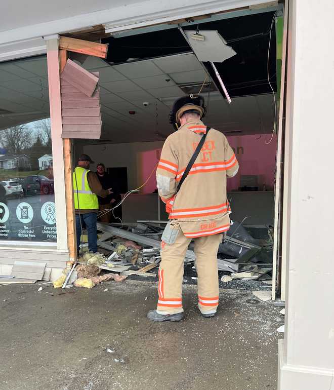 Car crashes into storefront in Essex Junction