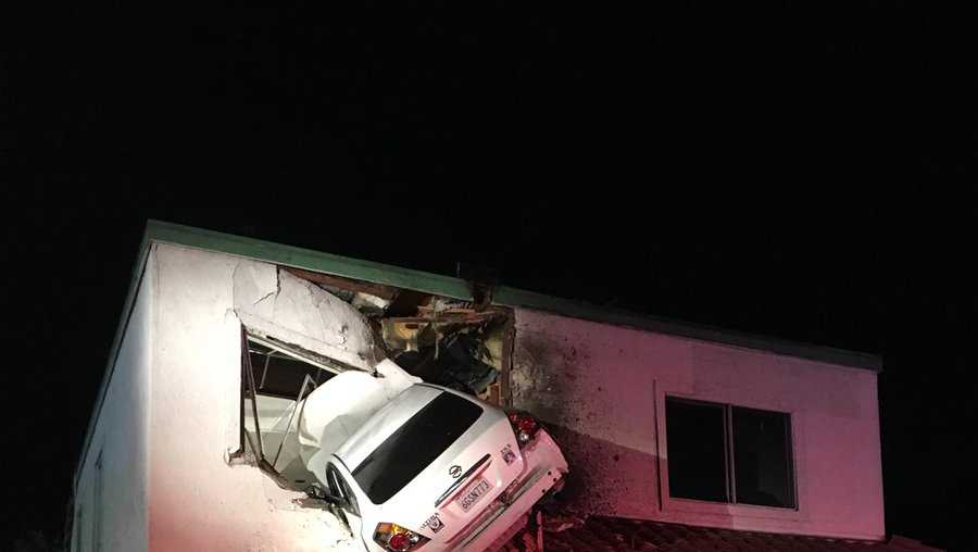 Car goes airborne, crashes into second floor of California office building