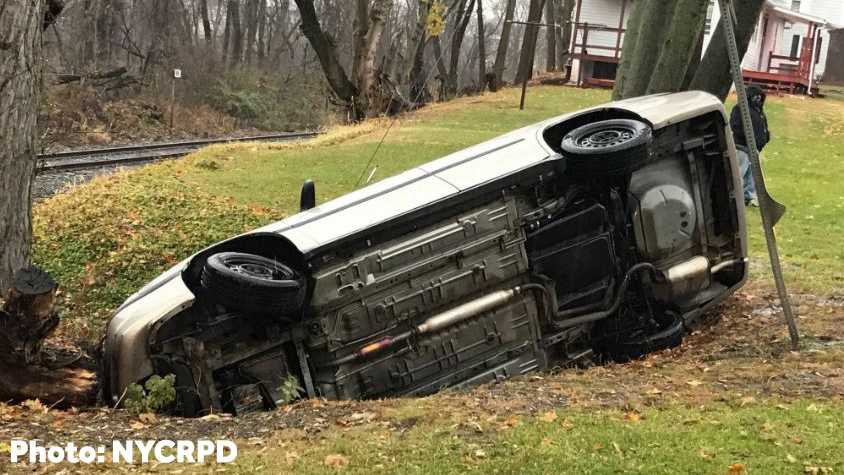 Car Slides Off Road Into Ditch
