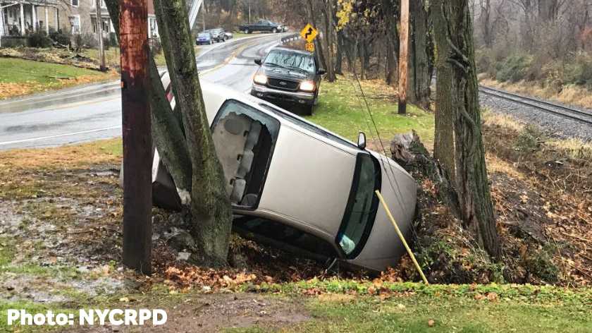 Car Slides Off Road Into Ditch