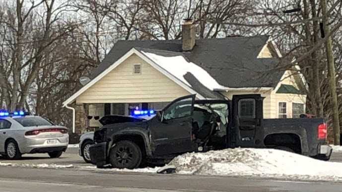 Police officer hospitalized after cruiser hit by pickup truck truck in ...
