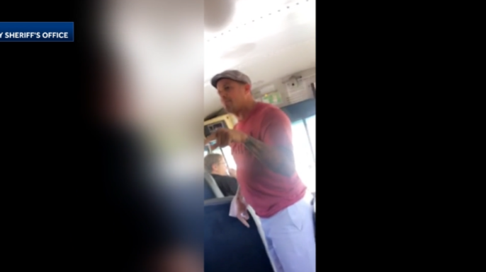 Video shows man smacking school employee on bus, sheriff says