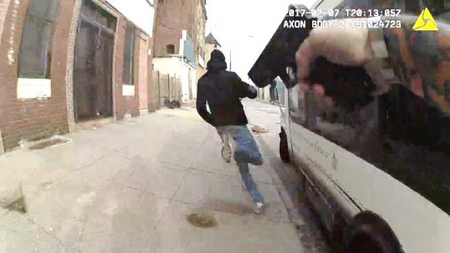 Photos: Police body camera images show suspect pointing gun at officer