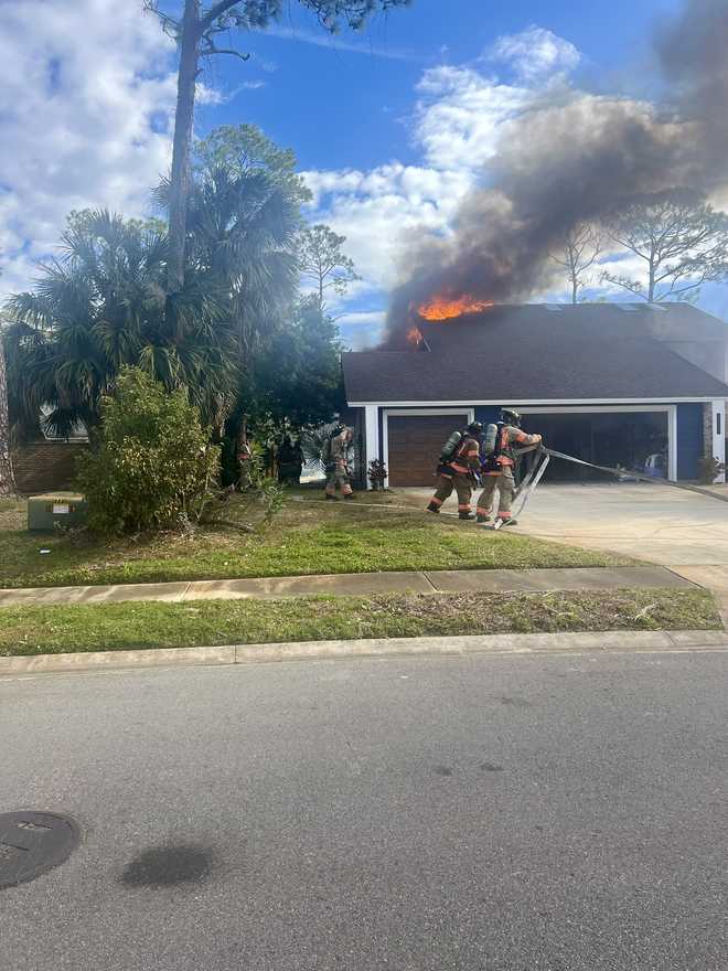 PHOTOS: Firefighters battle house fire in Daytona Beach
