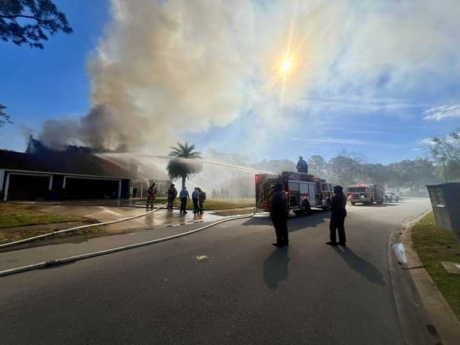 PHOTOS: Firefighters battle house fire in Daytona Beach