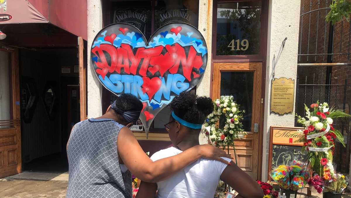 Messages of encouragement line street where 9 were killed