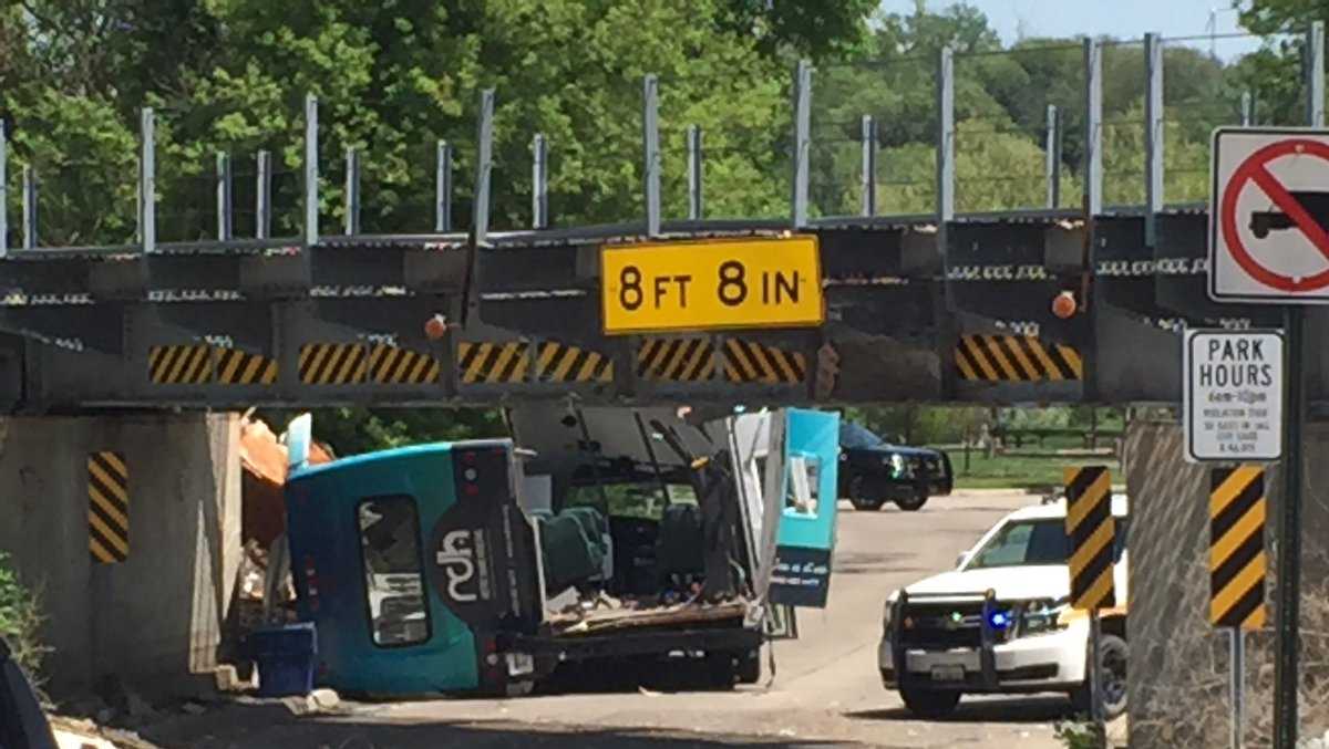 Shuttle bus too tall to go under bridge
