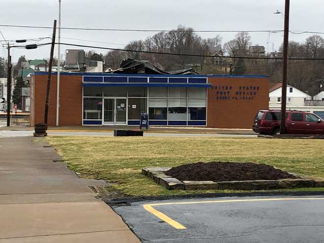 Roof partially blown off post office in Derry