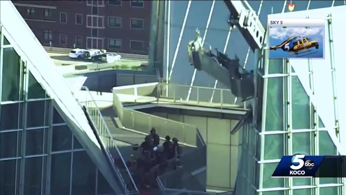 Window washers in good spirits after brush with death above Devon Tower