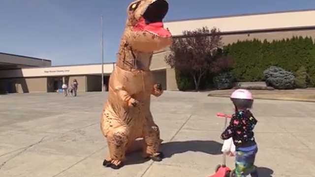 Aww! Educator dresses up as T. rex to help bring comfort to kids