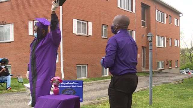 Local high school director hand delivers diplomas to graduates