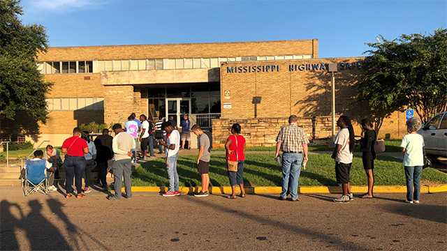 Long lines form at DMV day after system outage closes offices