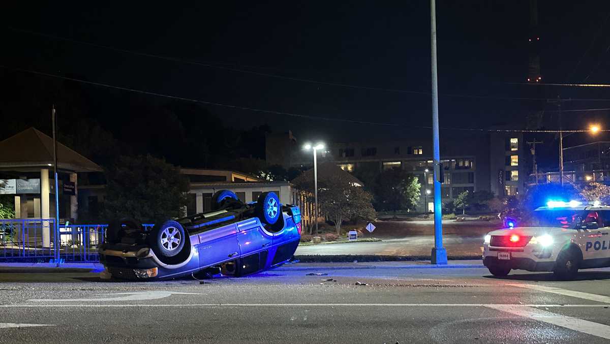 Police investigating crash that left car flipped on top in Mt. Auburn