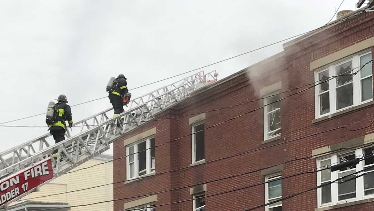 Fire begins in basement, spreads up through roof of apartment building