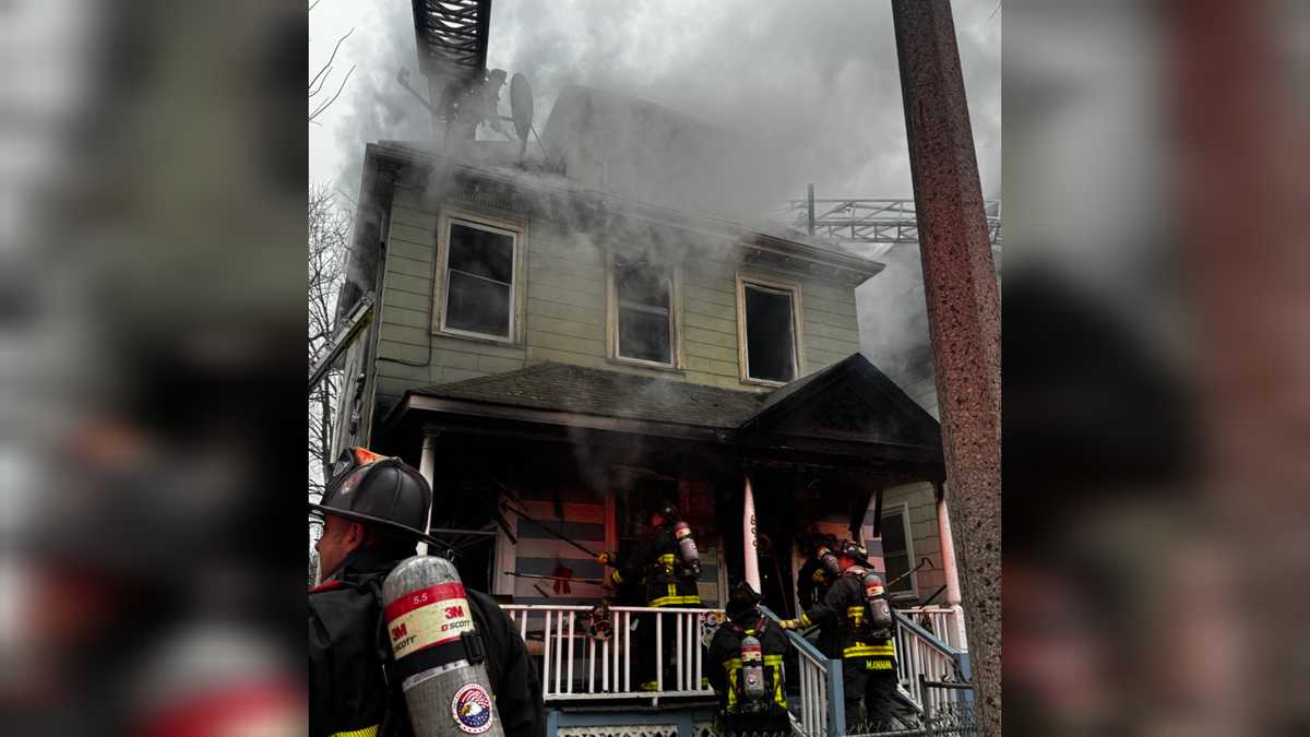 Firefighters battling 2nd alarm house fire in Dorchester