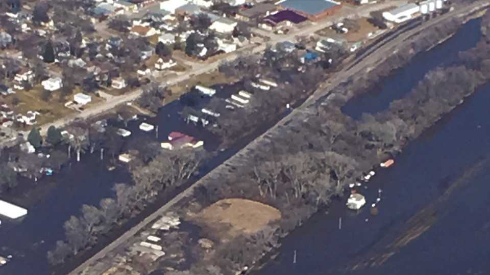Flooding aftermath: damage to homes, roads
