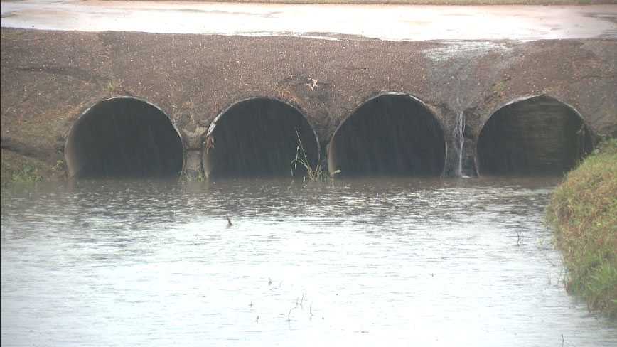 Residents in flood-prone areas watch rain warily