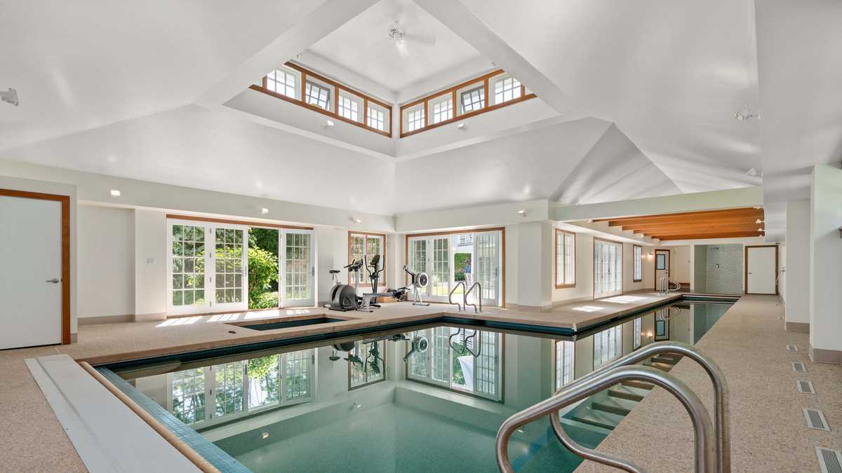 Stunning $3.49M country manor has indoor pool, tennis court