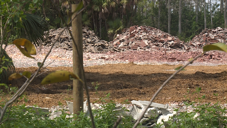 Florida landscaper says neighbor dumping landfill on land