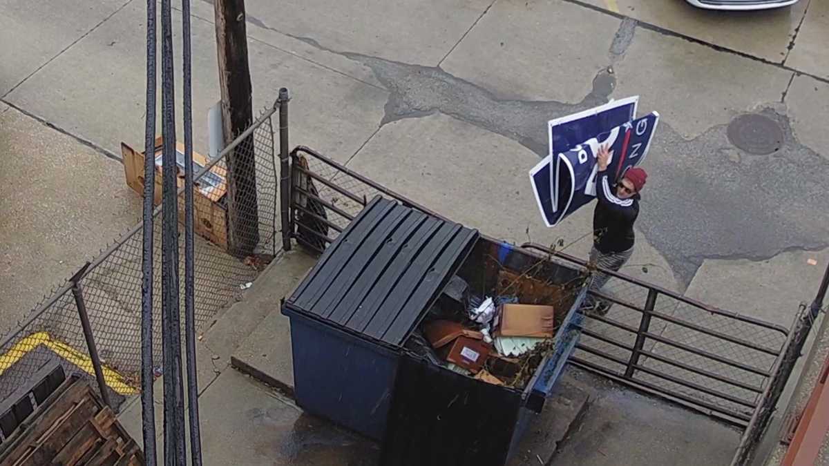 Caught on camera: Person tosses Bacon campaign sign in dumpster