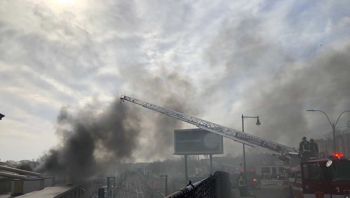 Raging fire at East Boston business prompts evacuations, MBTA disruption