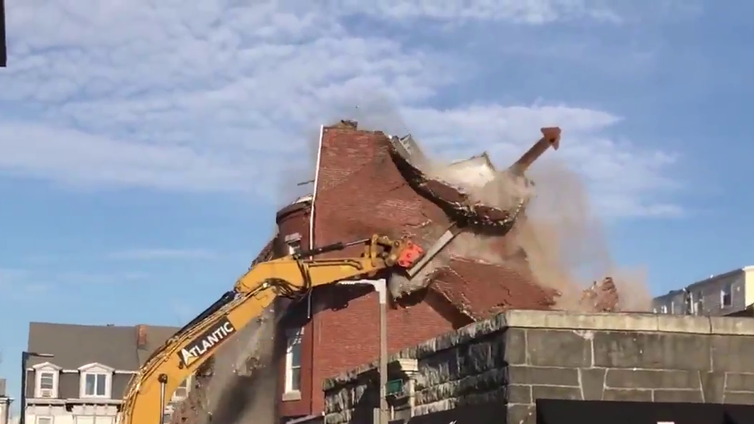 Demolition crew tears down building after partial collapse
