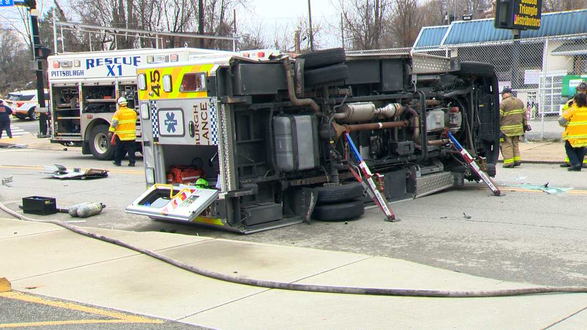 Ambulance lands on its side after crash in Pittsburgh's East Hills