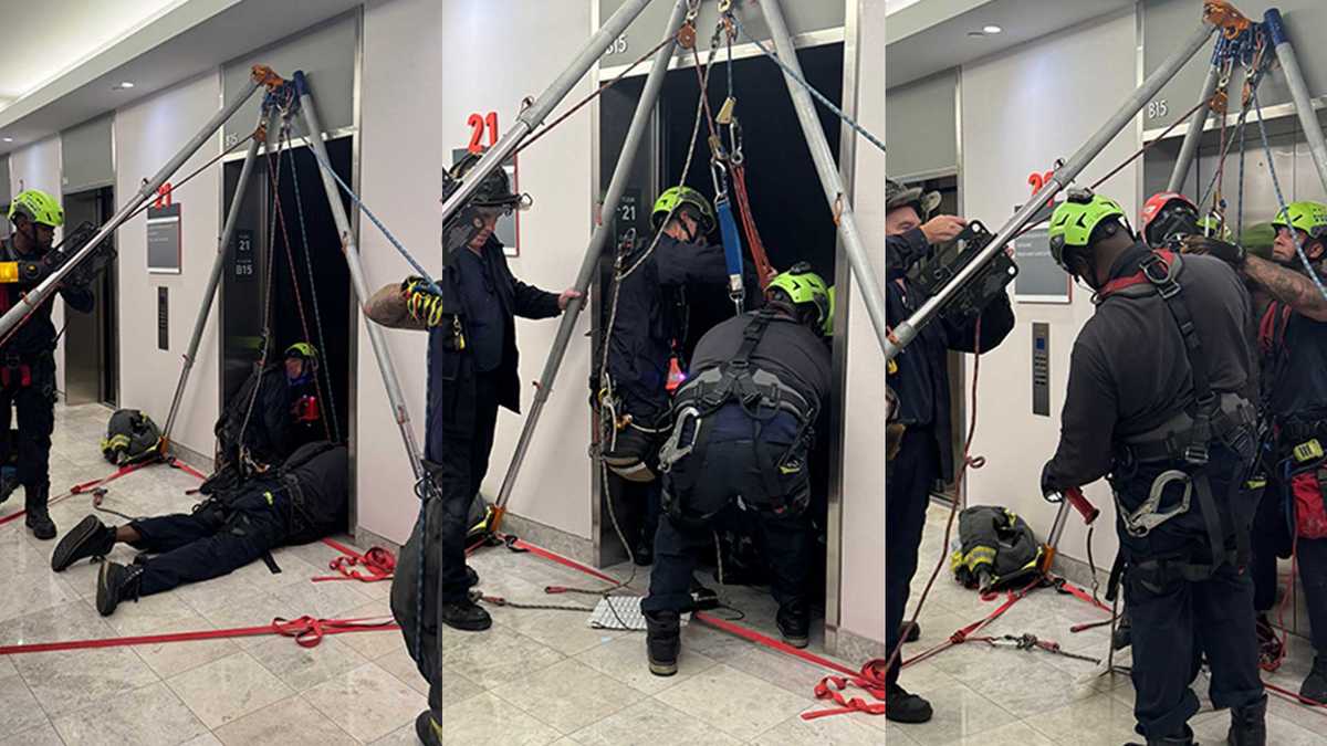 Firefighters hoist man up elevator shaft in Boston building