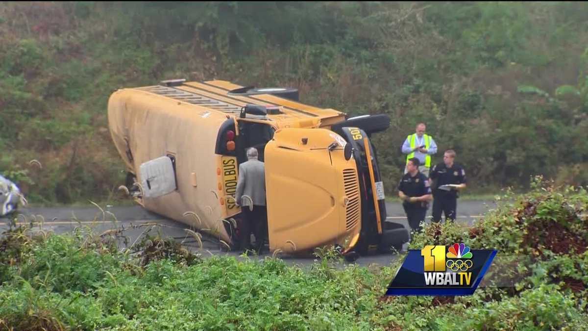 PHOTOS: Schools bus overturns in Ellicott City crash