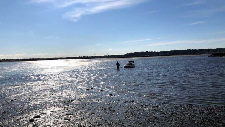 Woman rescued, car pulled from marsh in Wells