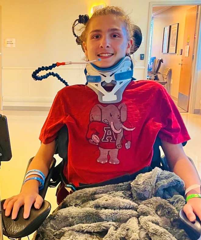Minnesota's biggest Bama fan back to class after being paralyzed