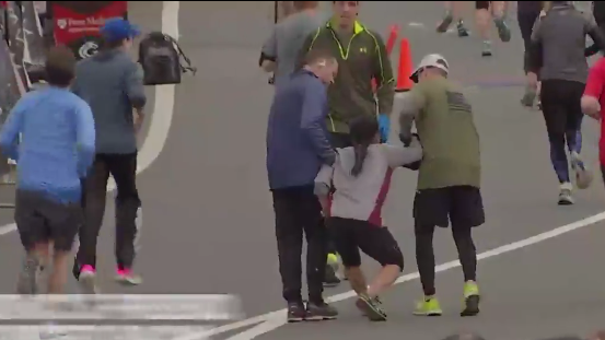 Runners help fatigued woman finish half-marathon