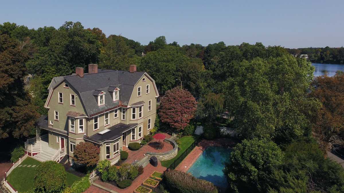 $4.25M Notable stucco colonial revival sits on most desirable street