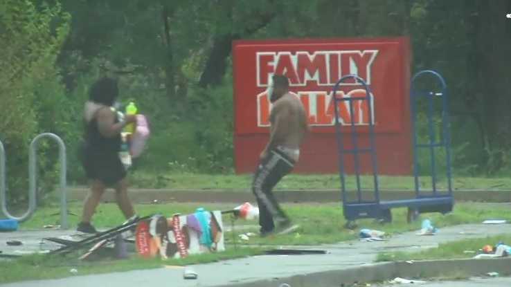 Reporter confronts looters at Family Dollar store