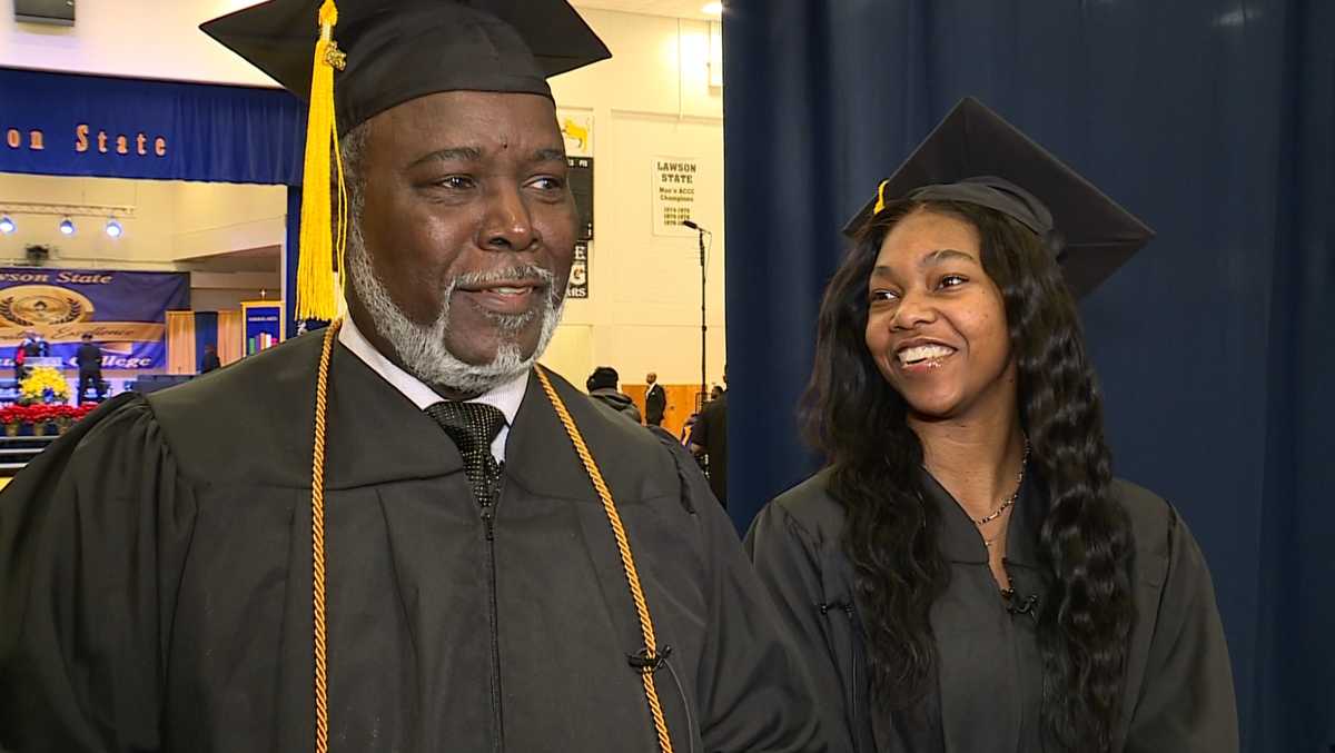 Father and daughter walk together at Lawson State graduation