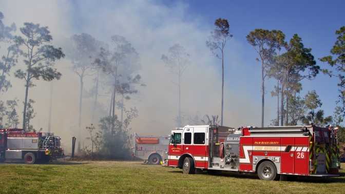 Firefighters battling to contain brush fire in Loxahatchee