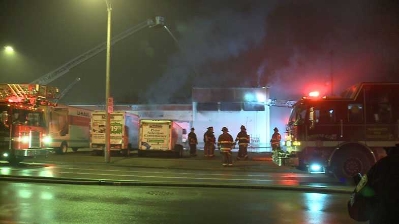 Firefighters battle heavy smoke, flames at furniture store fire