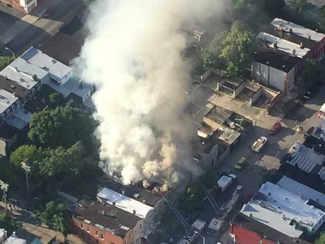 Crews battle house fire in north Baltimore