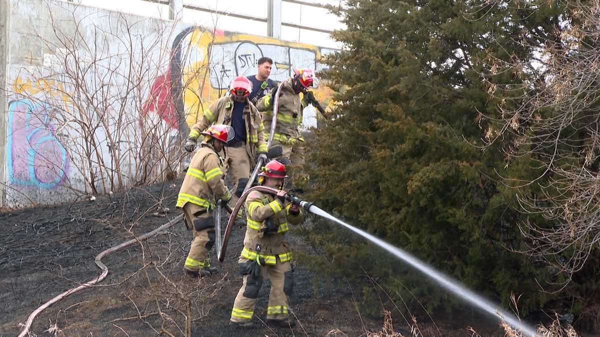 Omaha firefighters battle field fire near train tracks