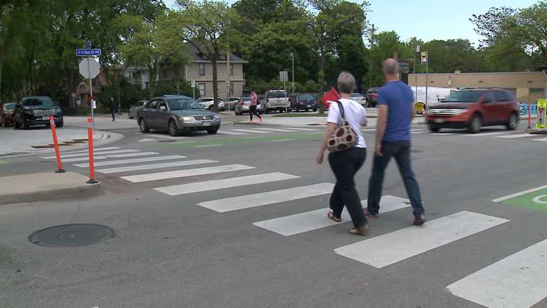 Pedestrians can carry red flags across busy Wauwatosa intersections to ...