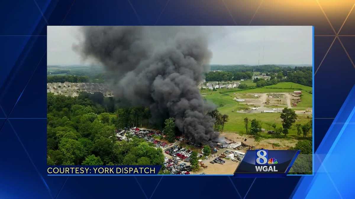 Explosions heard as fire rips through salvage yard; 1 Injured