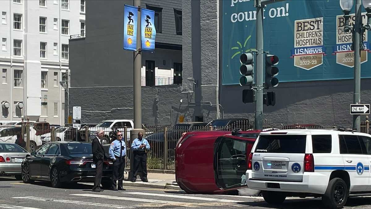 New Orleans police flipped car Poydras Street