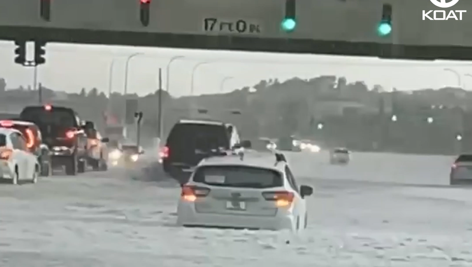 Car gets stuck in flooding on busy intersection in Albuquerque