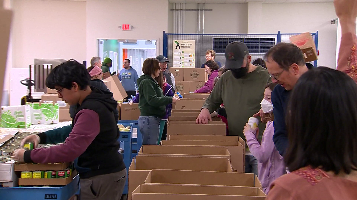 Young volunteers pack boxes for 'Food for Free'
