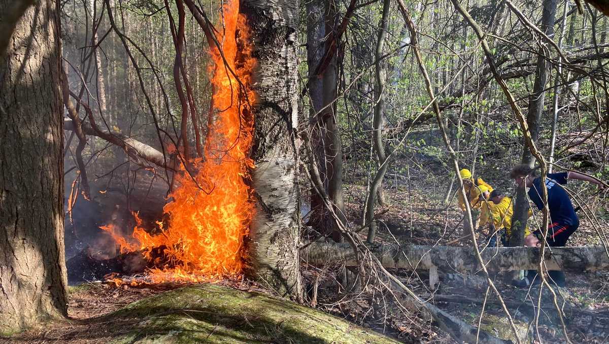 Emergency crews in Vermont hike steep terrain to contain fire