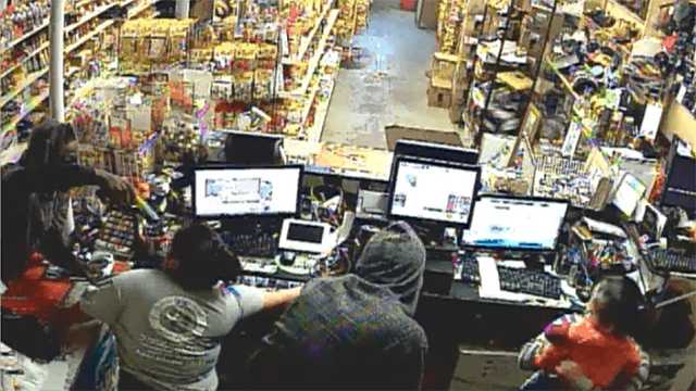 Disturbing video: Store clerk held at gunpoint during robbery