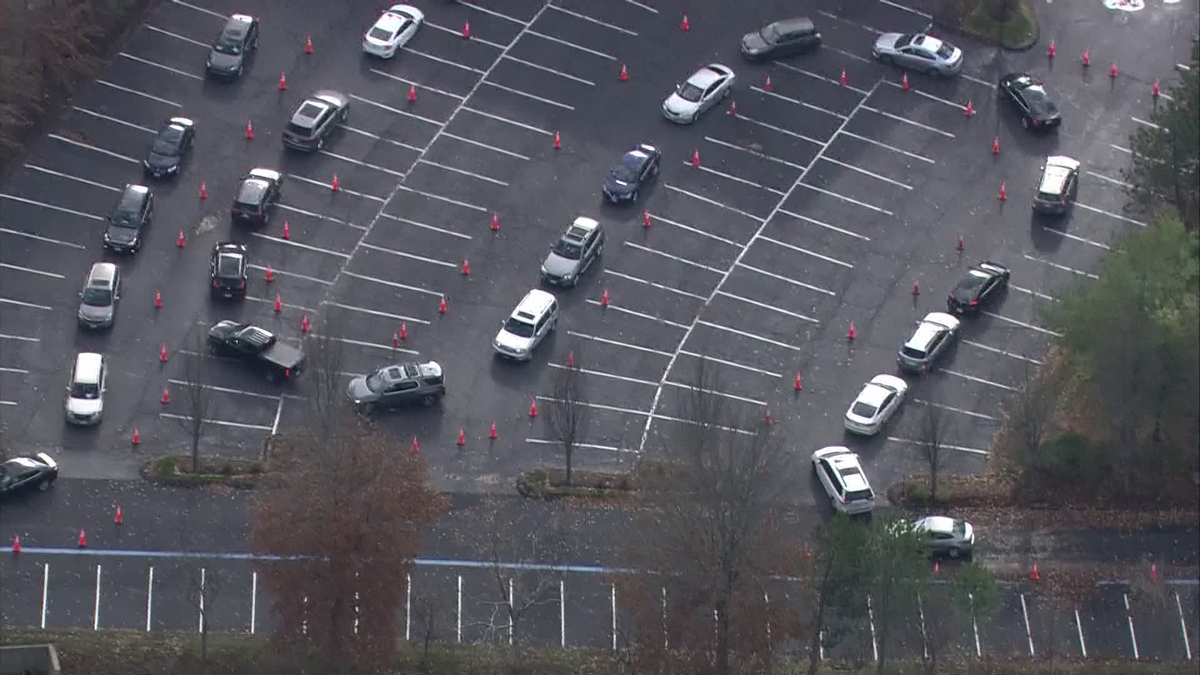 Long lines snake through parking lots at free COVID-19 testing facilities