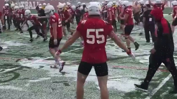 Shirtless Scott Frost, Huskers enjoy first snow with snow angels